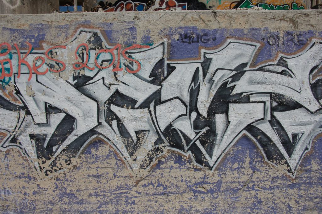 White And Blue Spray Paint Graffiti On Wall - Texture X